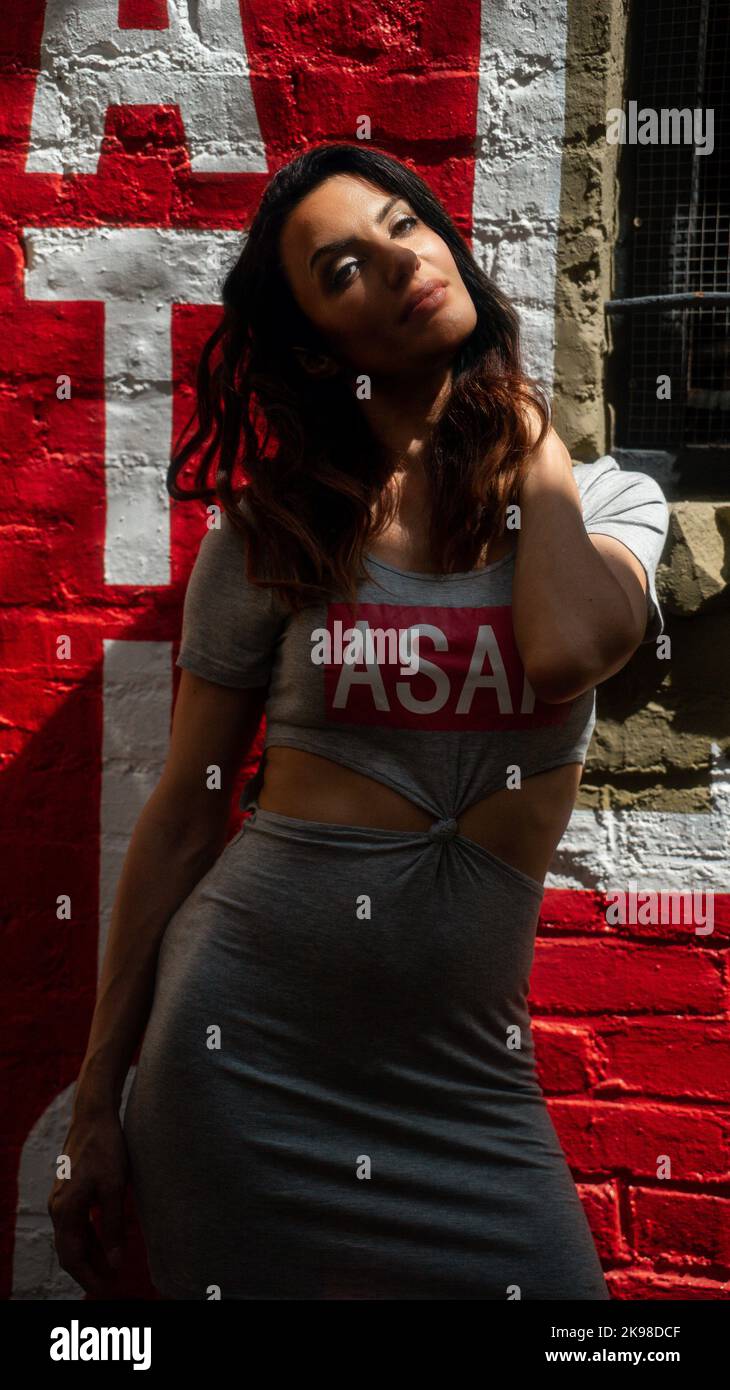 Italian model modelling in front of an artistic wall Stock Photo - Alamy