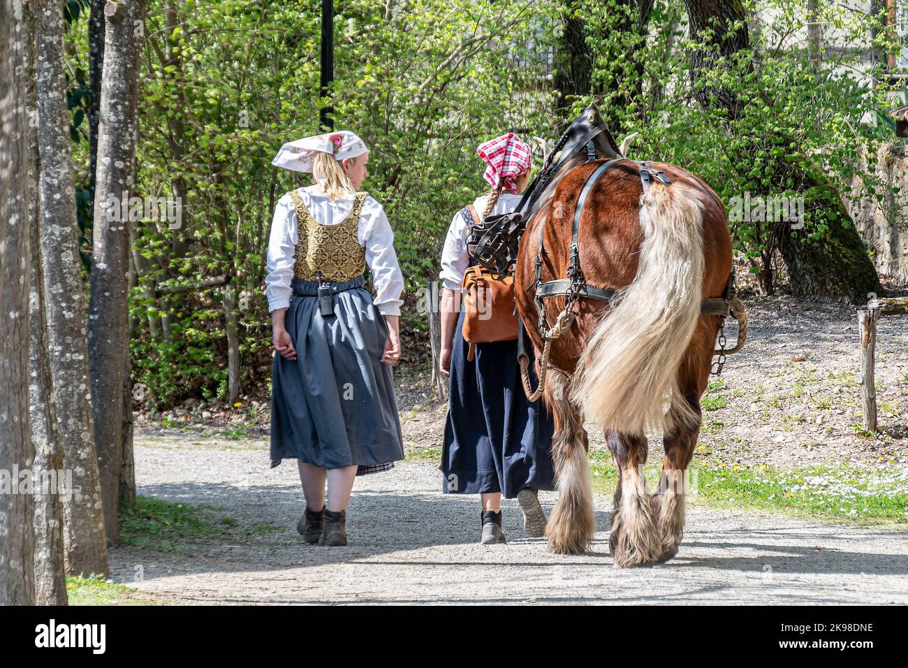 Alsace, France - 20.04.2022-Two girls in traditional dress with a horse ...