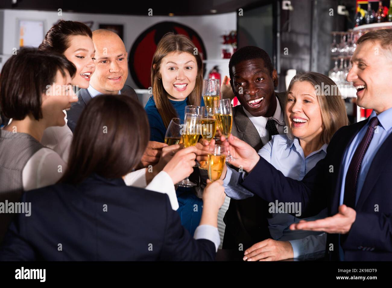 International group of businesspeople toasting with champagne, having ...