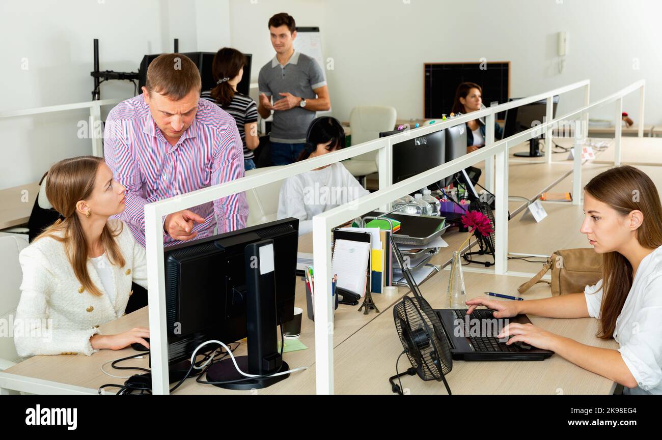 International business team working and communicating together in ...