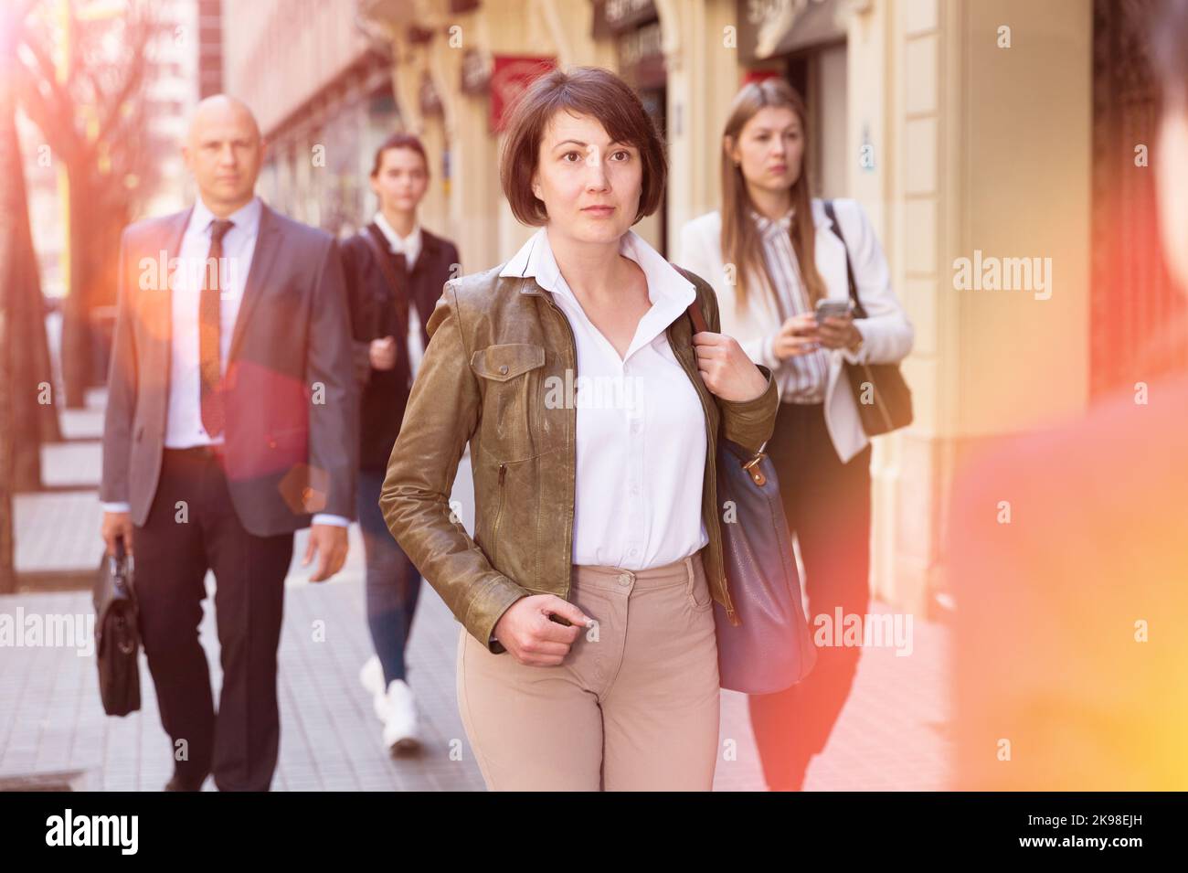 People walking down street in downtown Stock Photo - Alamy