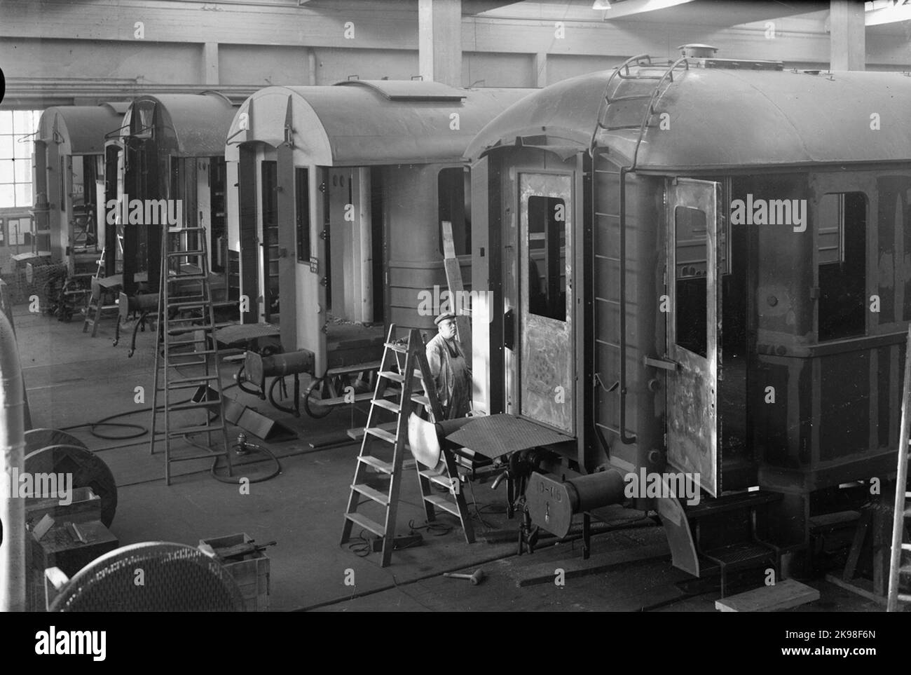 Interior with railway wagons in mounting hall Stock Photo - Alamy