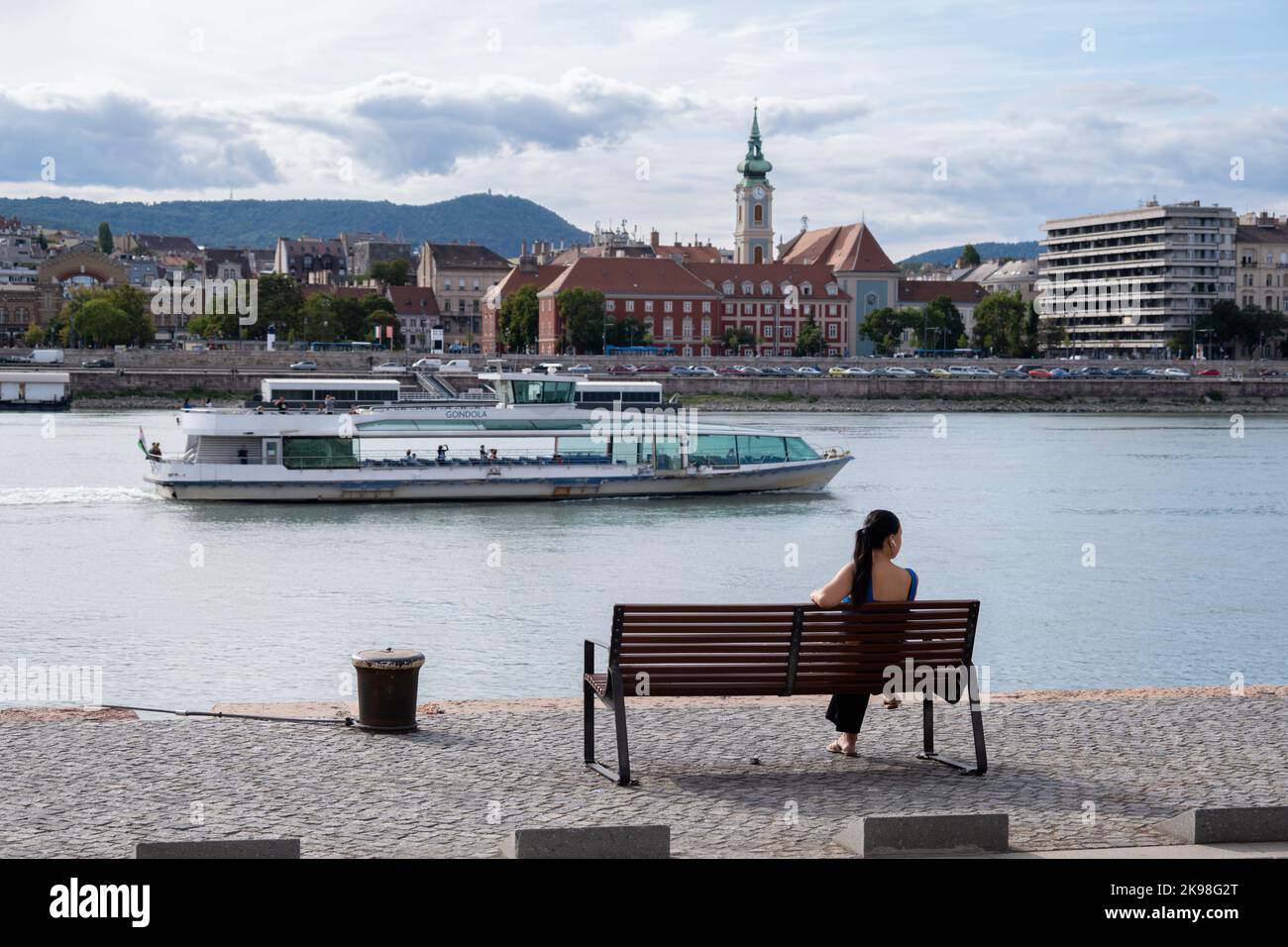 Budapest, Hungary - 1st September 2022: Woman sitting on a bench on the ...