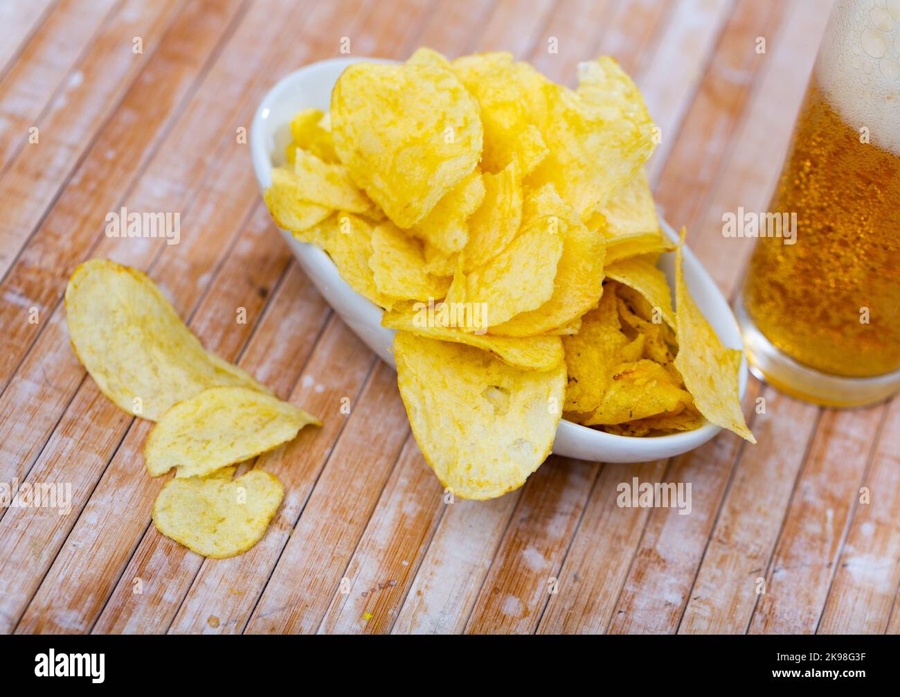 Chips served as snack food with beer Stock Photo - Alamy