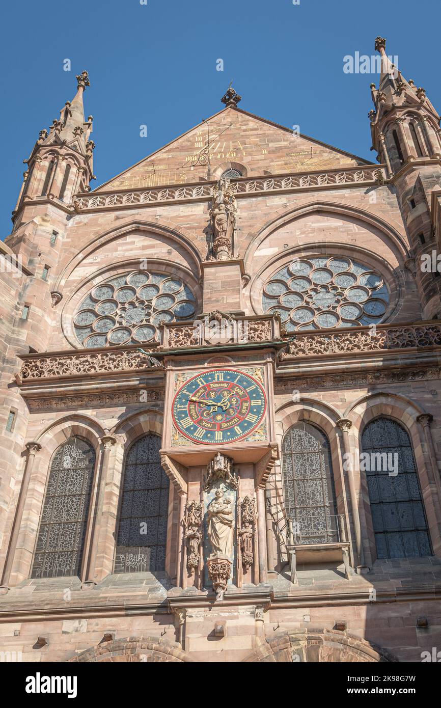 The statue of Mary and a clock on the Gothic facade of the Strasbourg ...