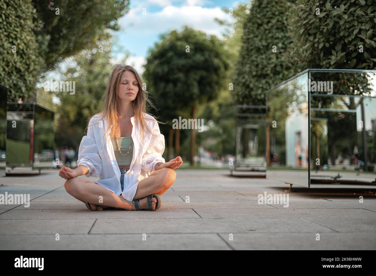 Girl practice yoga meditation outdoor in park Stock Photo - Alamy