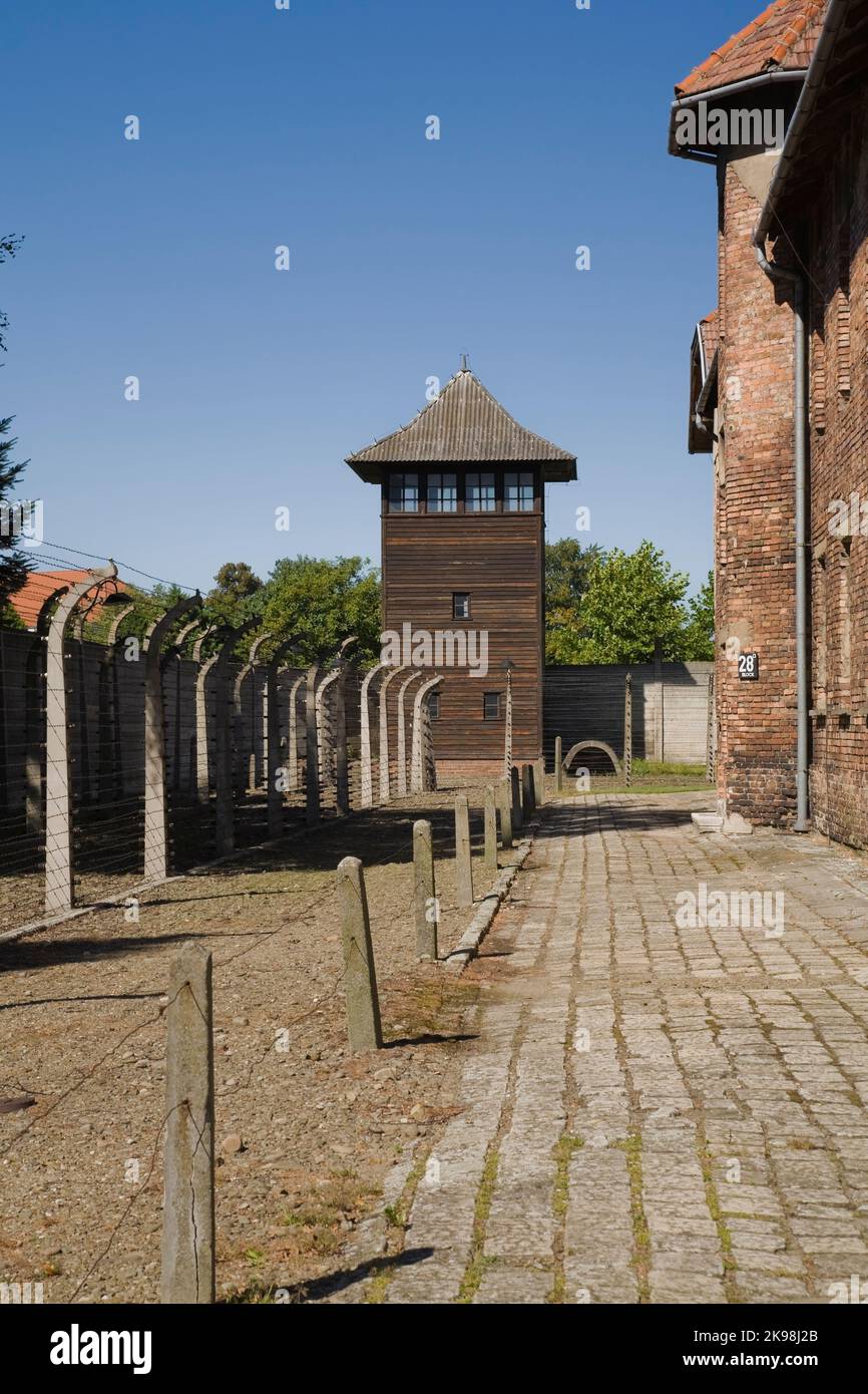 Electrified barbwire fences and guard tower inside the Auschwitz I ...