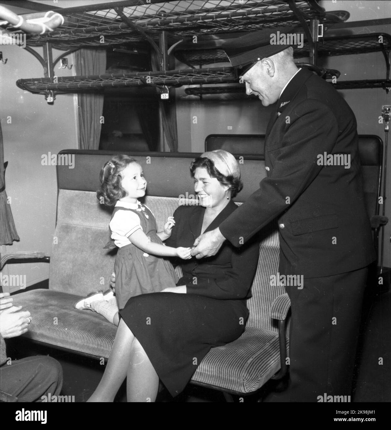 Girl with mom on the train shows children's ticket Stock Photo - Alamy