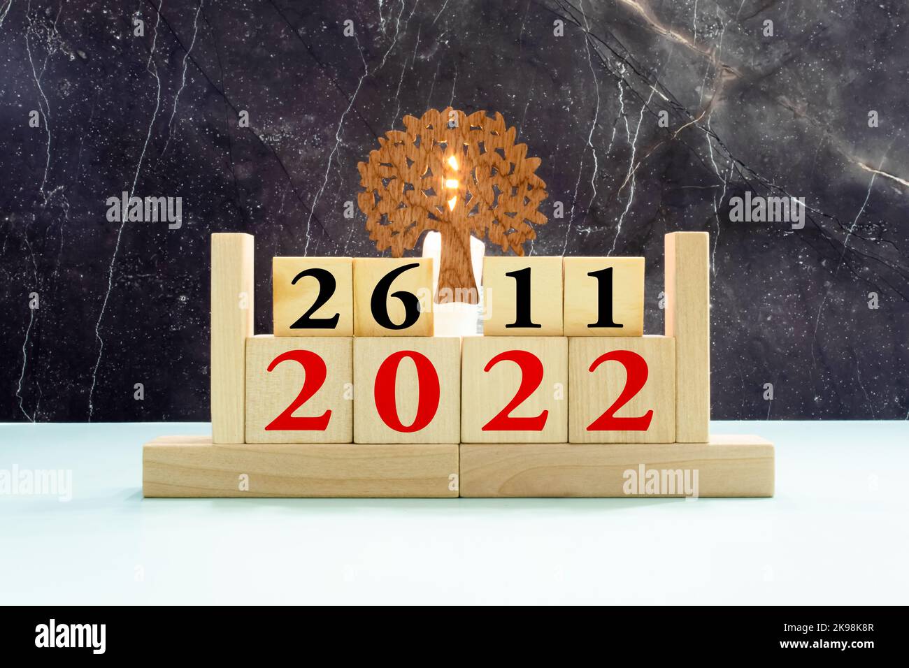 Wood calendar with date and old clock. Tuesday 26 November Stock Photo ...
