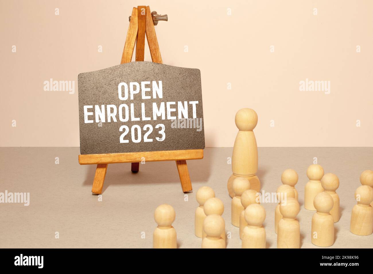 Open Enrollment. Text and a man's hand holding a black marker on a ...