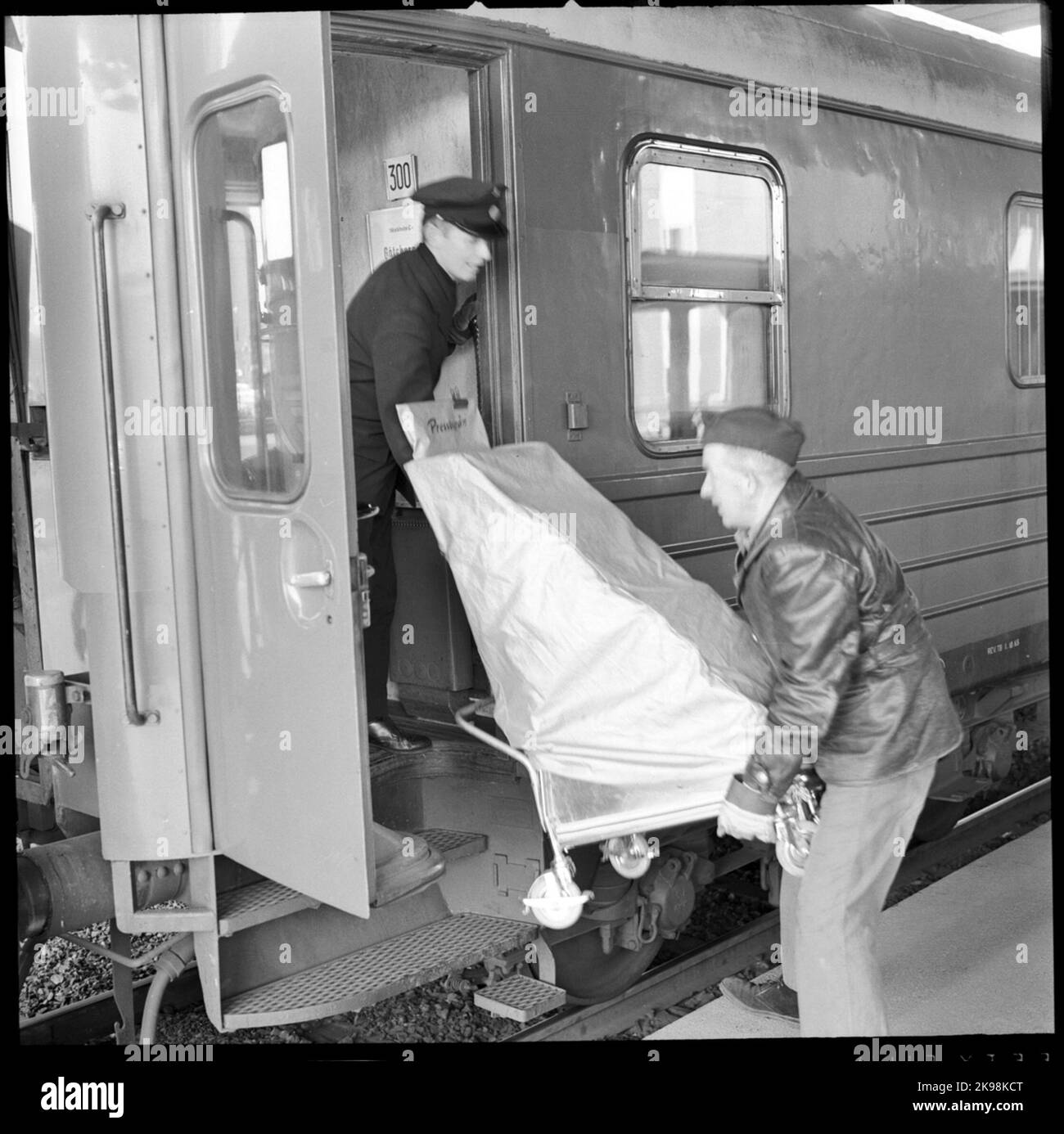 Newspaper sales on trains. "Train Bud" Sonny Hultberg Stock Photo - Alamy