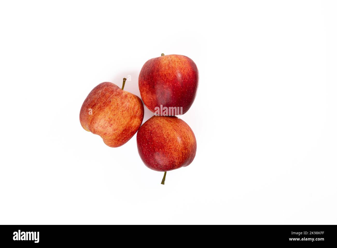 Three apples on a white background. Three sweet red apples on a ...