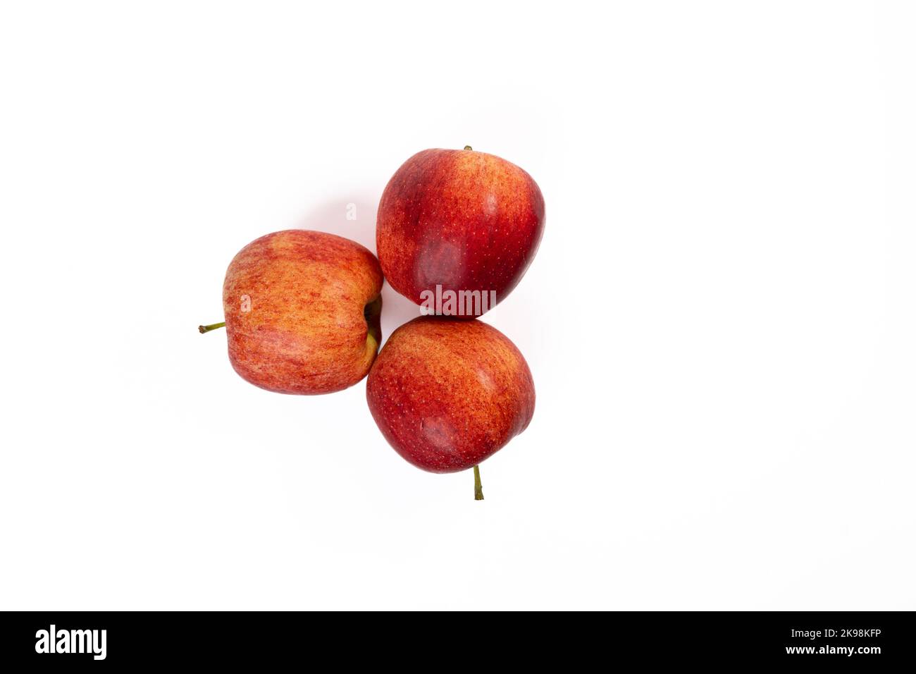 Three apples on a white background. Three sweet red apples on a ...