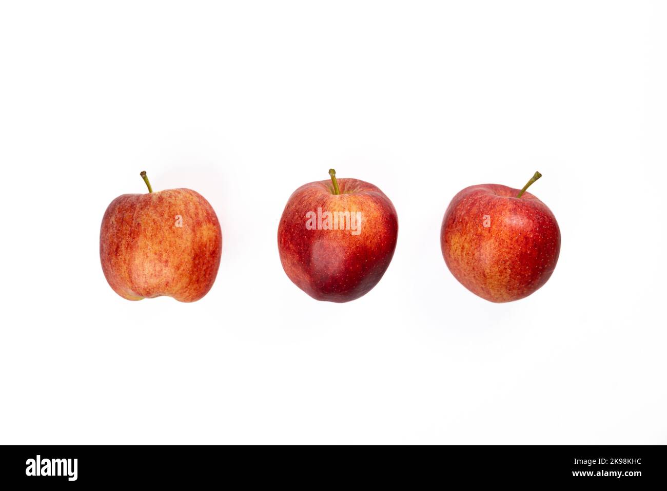 Three apples on a white background. Three sweet red apples on a ...