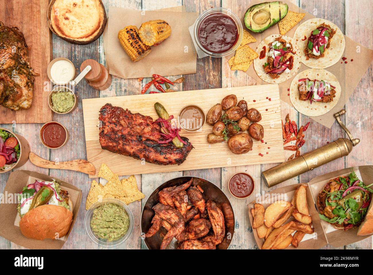 Set of delicious appetizer plates, tapas and grilled chicken and pork ...