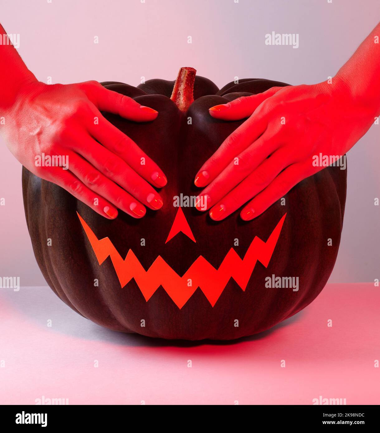 Halloween Pumpkin with Paper Cut Scary Face in red light. Jack ...