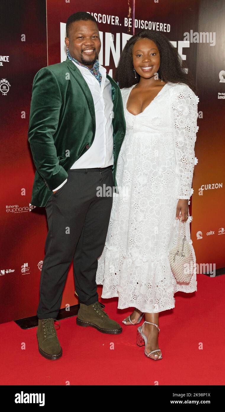 Mimi M. Khayisa (right) and guest attending the opening gala of the ...