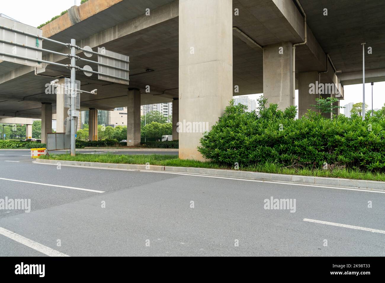 Concrete structure and asphalt road space under the overpass in the ...