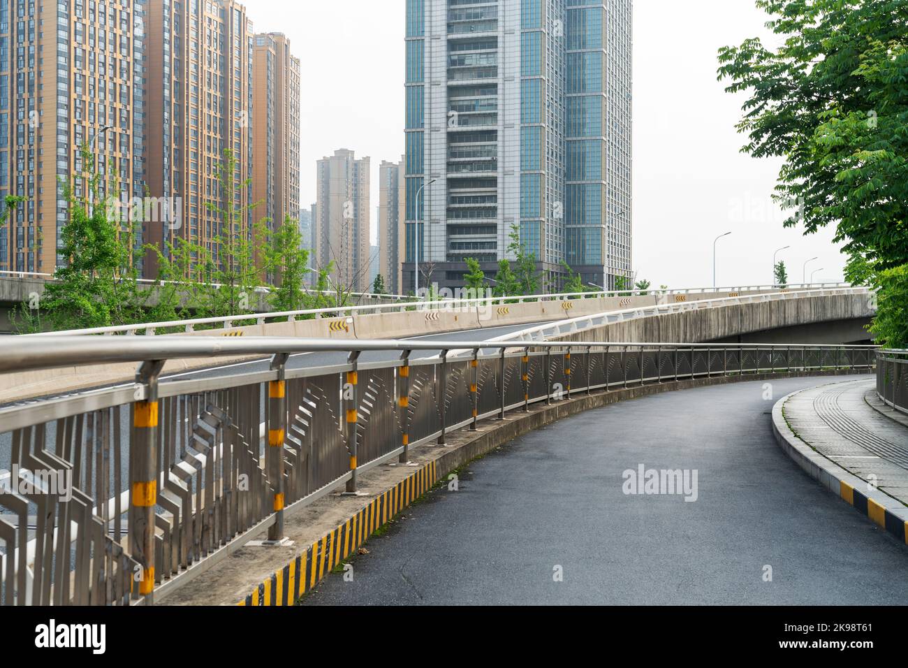 Highway overpass modern city skyline background Stock Photo - Alamy