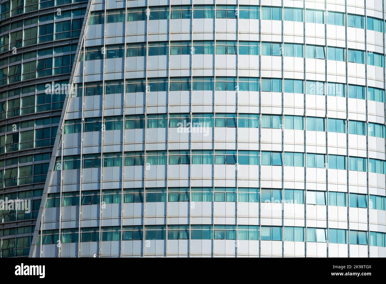 A beautiful background of an glass office building, reflecting clouds ...