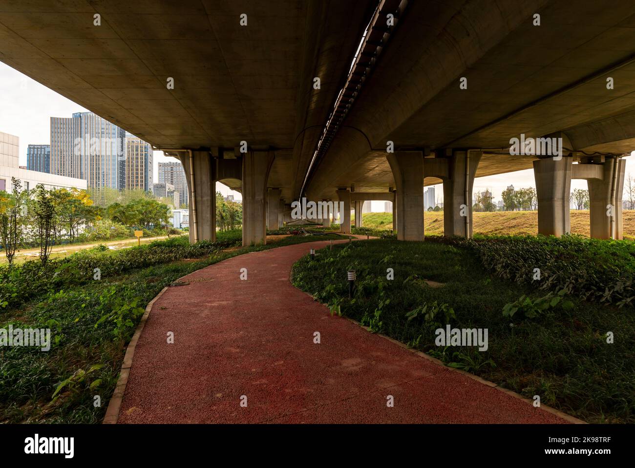 Concrete structure and asphalt road space under the overpass in the ...