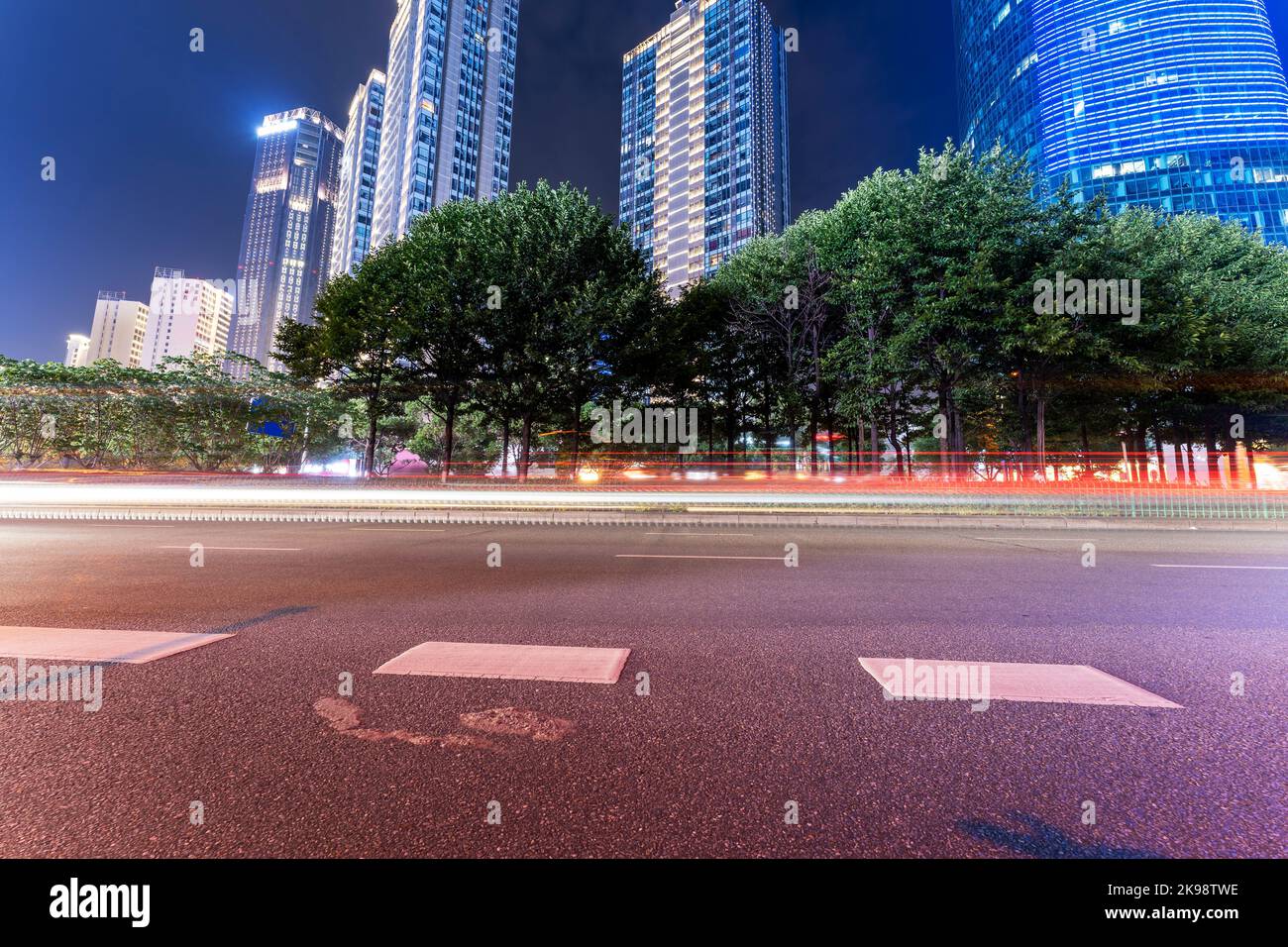 the light trails on the modern building background in shanghai china ...
