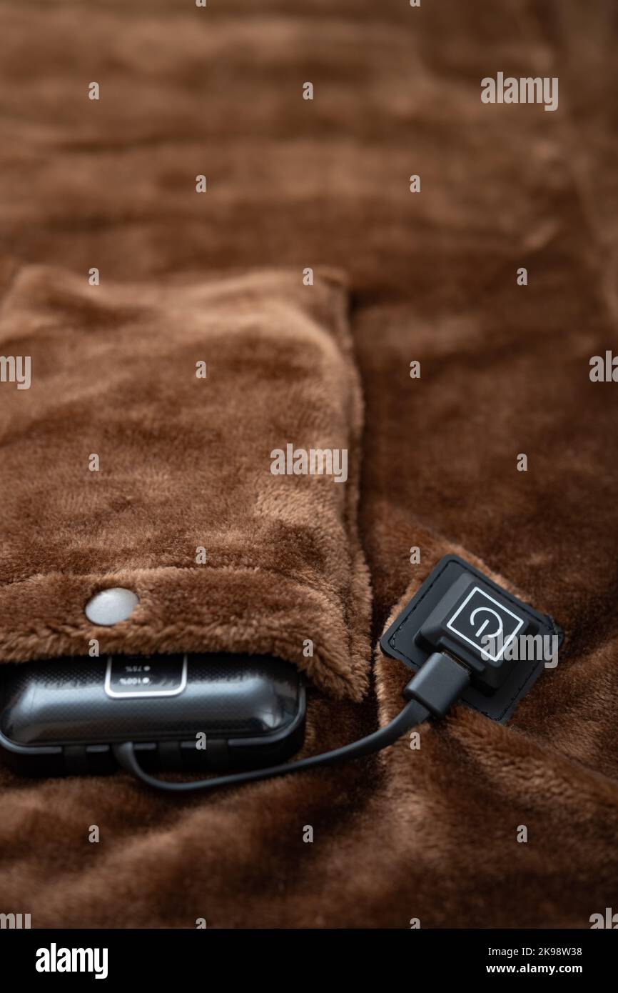 angle view electric blanket with portable charger as a power supply at ...