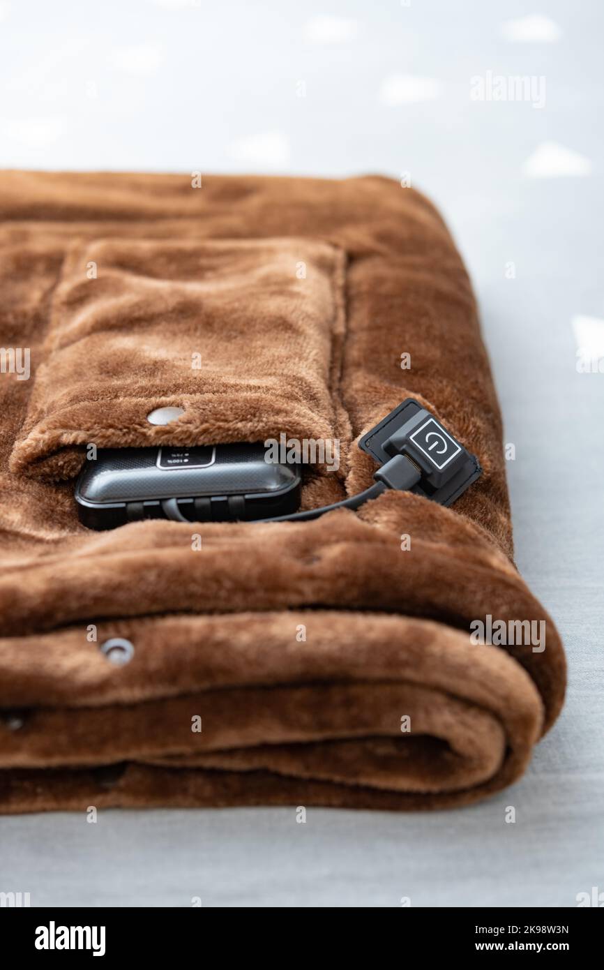 angle view folded electric blanket with portable charger as a power ...
