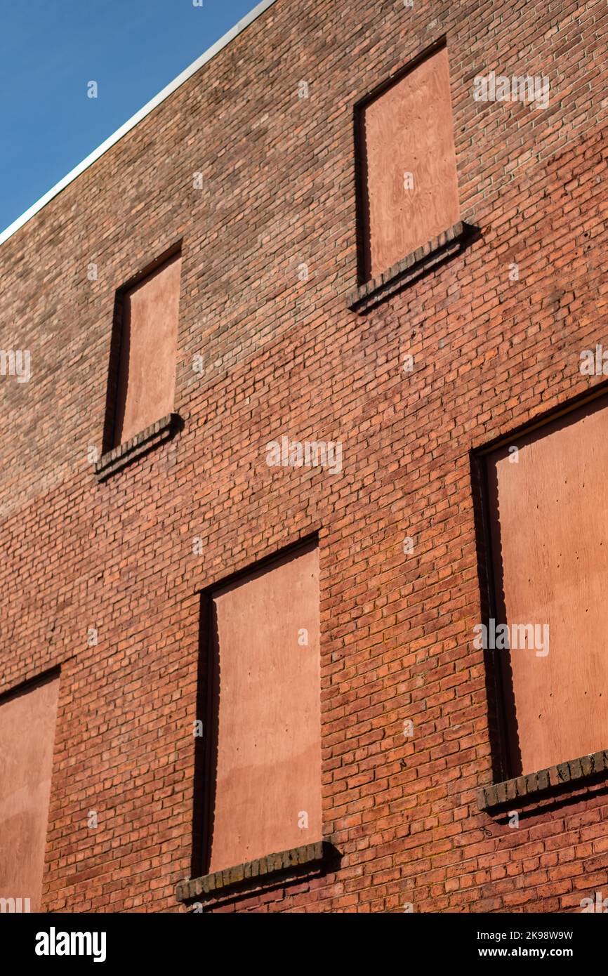 The building of the former factory of red brick. Red brick wall of a ...