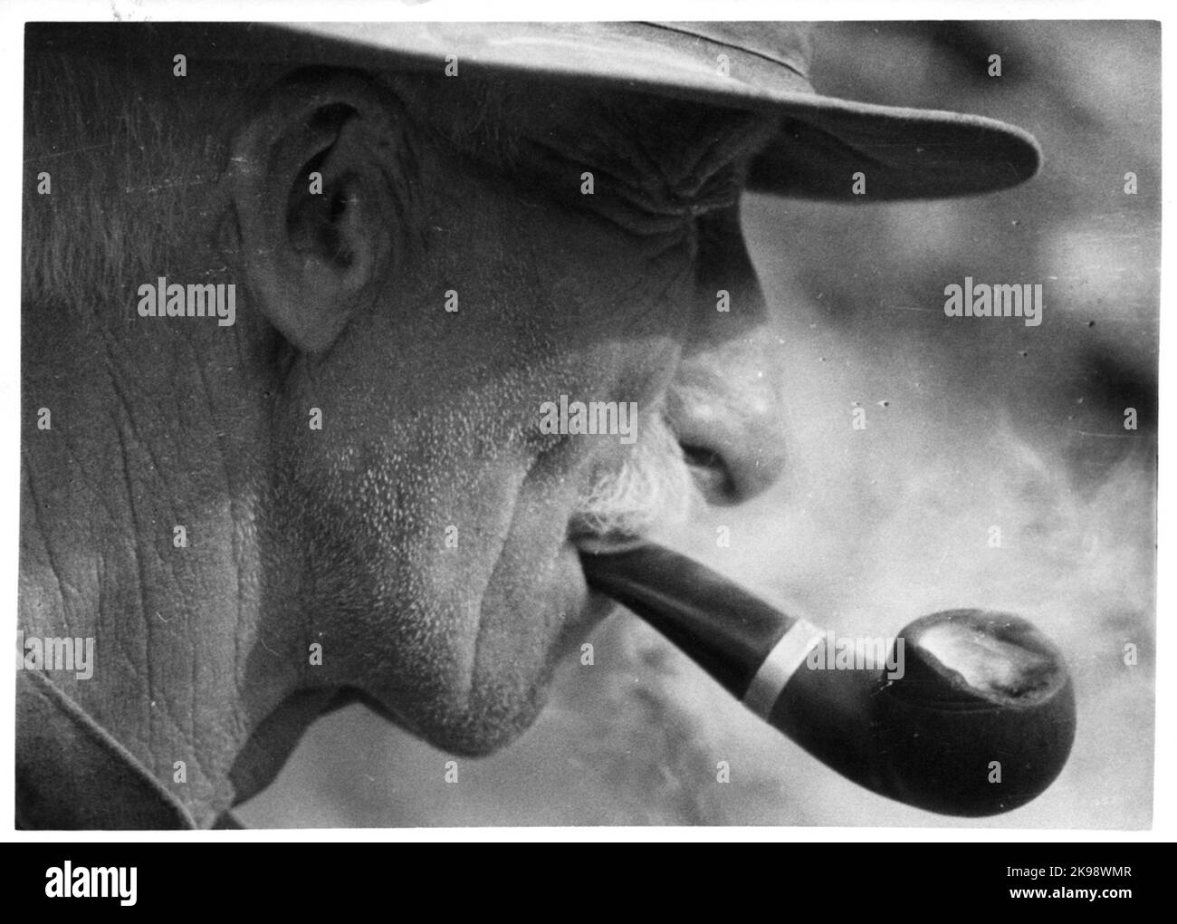 Man with a pipe from the movie "Kronans Rallare Stock Photo - Alamy