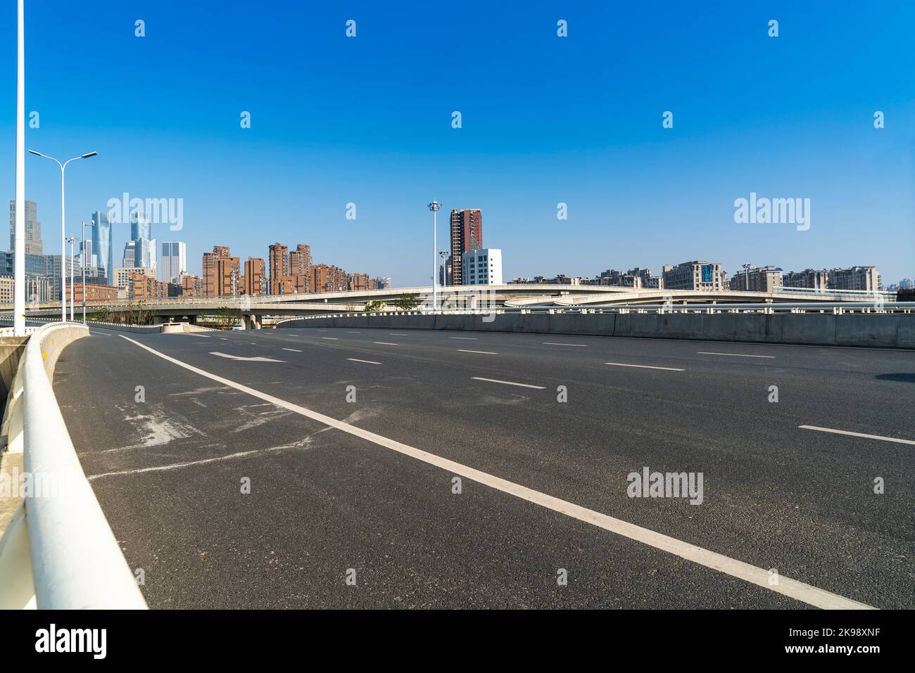 Highway overpass modern city skyline background Stock Photo - Alamy