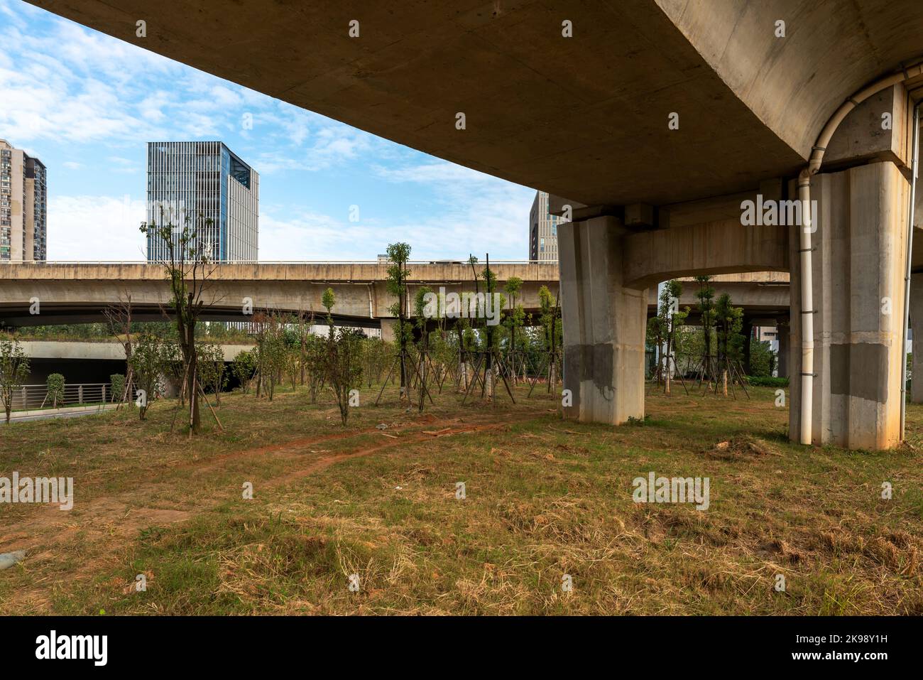 Concrete structure and asphalt road space under the overpass in the ...