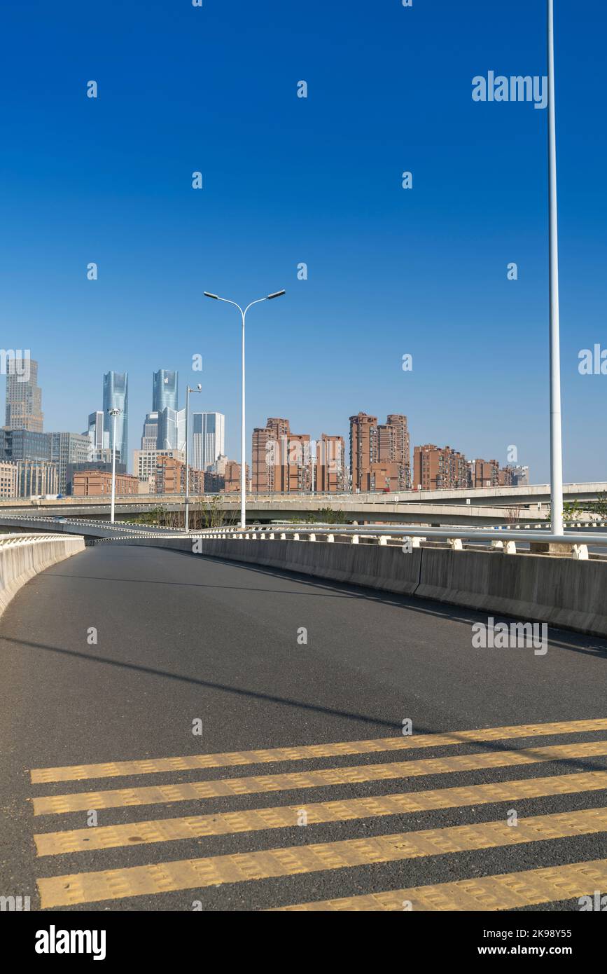 Highway overpass modern city skyline background Stock Photo - Alamy