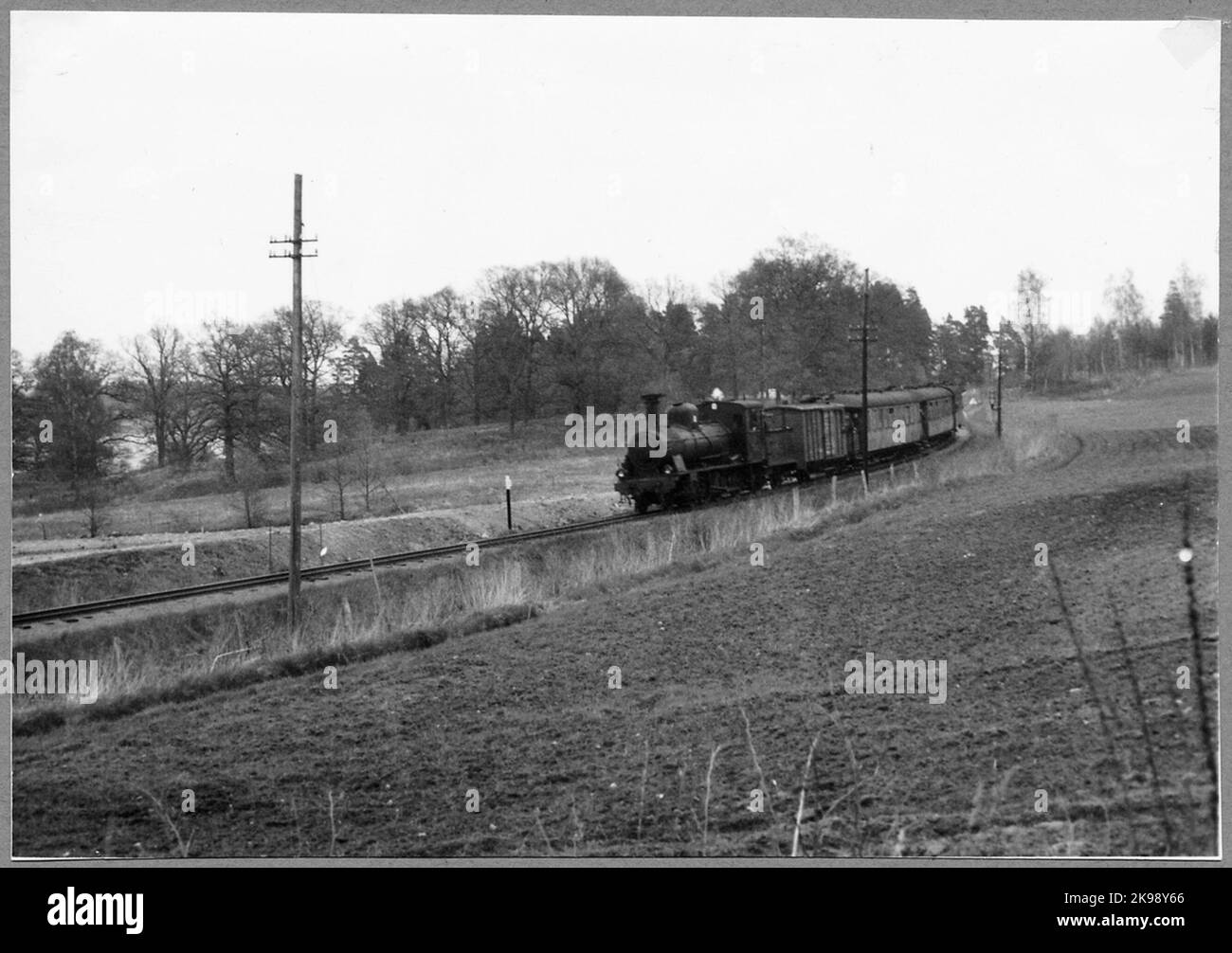 Passenger trains on railway Black and White Stock Photos & Images - Alamy