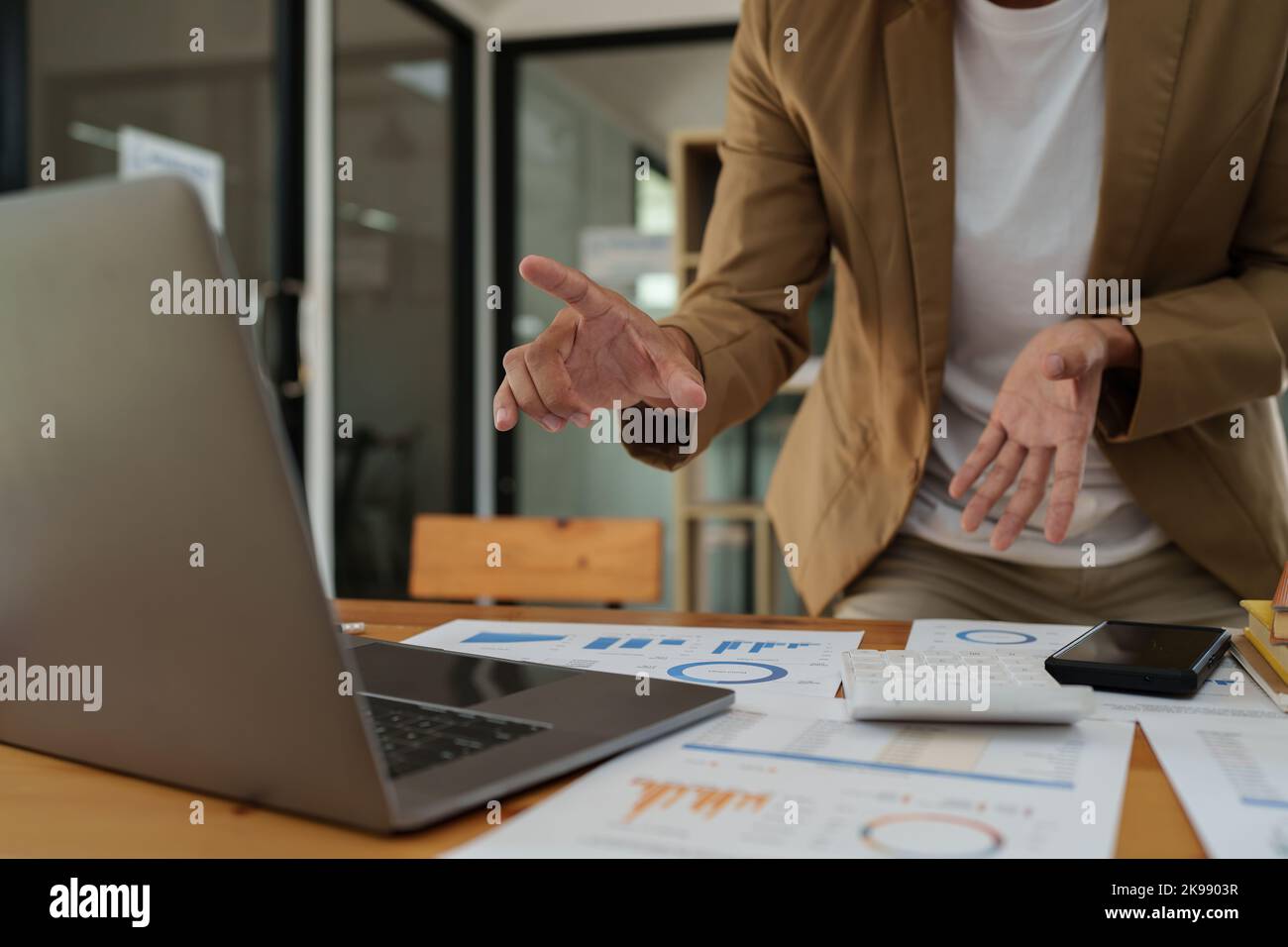 Asian businessman checking information while working with satisfaction ...