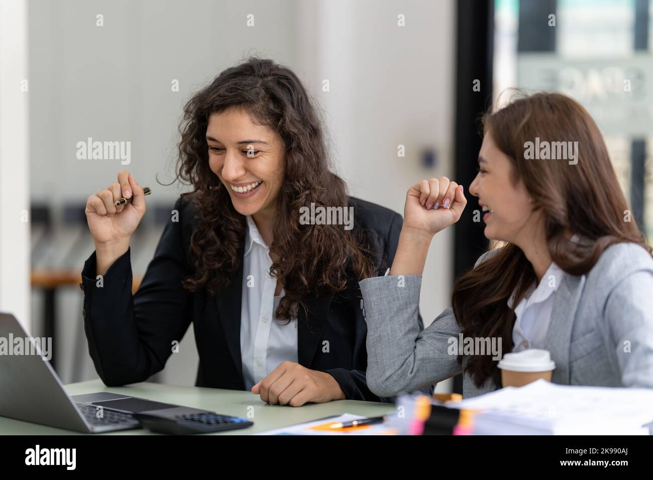 Smiling Businesswoman working with partner at office. finance concept ...