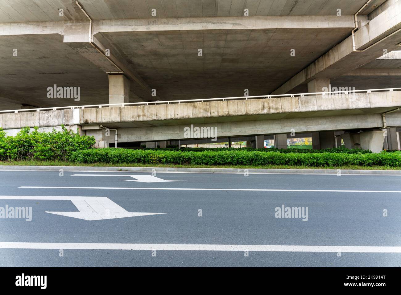 Concrete structure and asphalt road space under the overpass in the ...