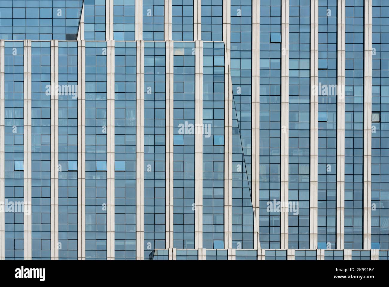 A beautiful background of an glass office building, reflecting clouds ...