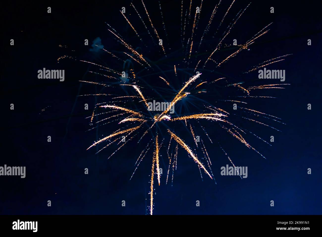 An explosion of bright single fireworks, against the background of the ...