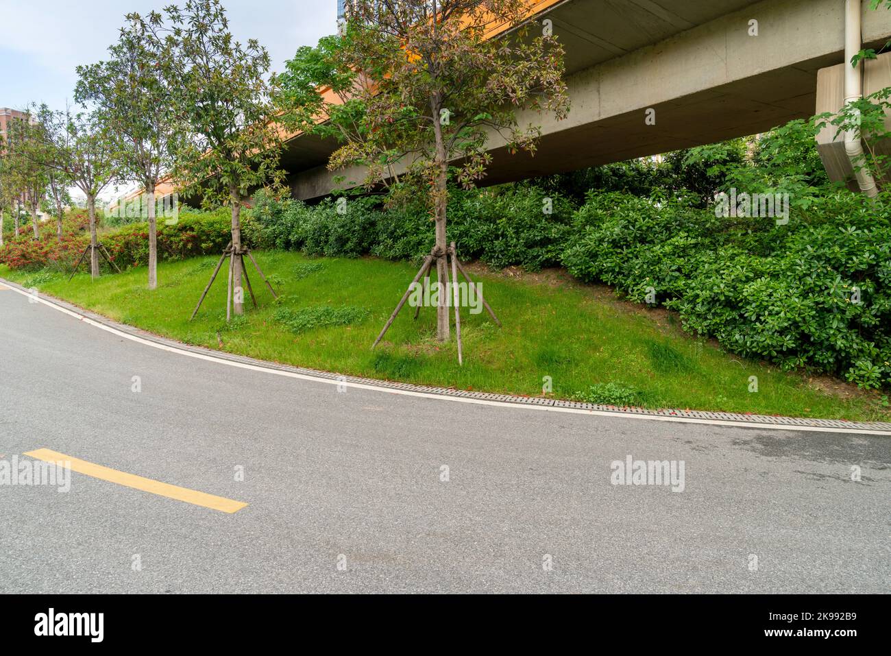 Concrete structure and asphalt road space under the overpass in the ...