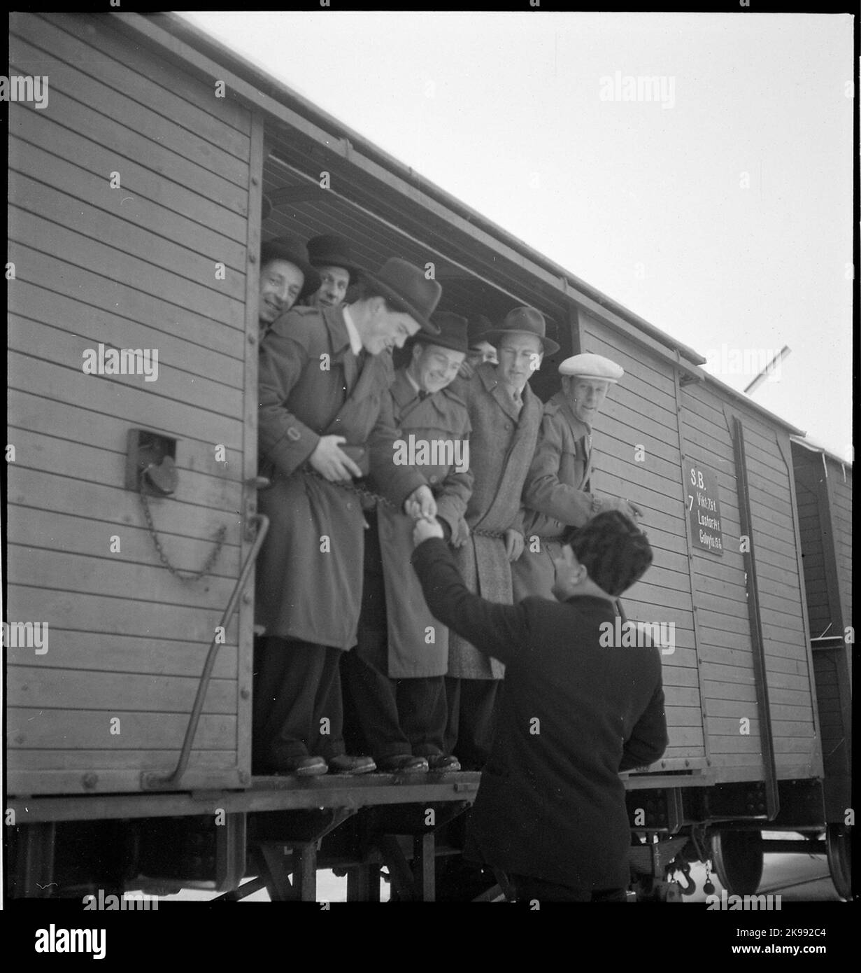 Conductor with travelers Stock Photo - Alamy
