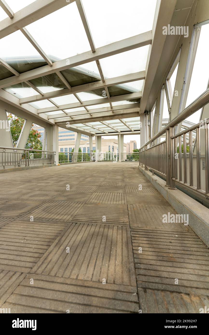 Inside of a modern overhead pedestrian bridge Stock Photo - Alamy