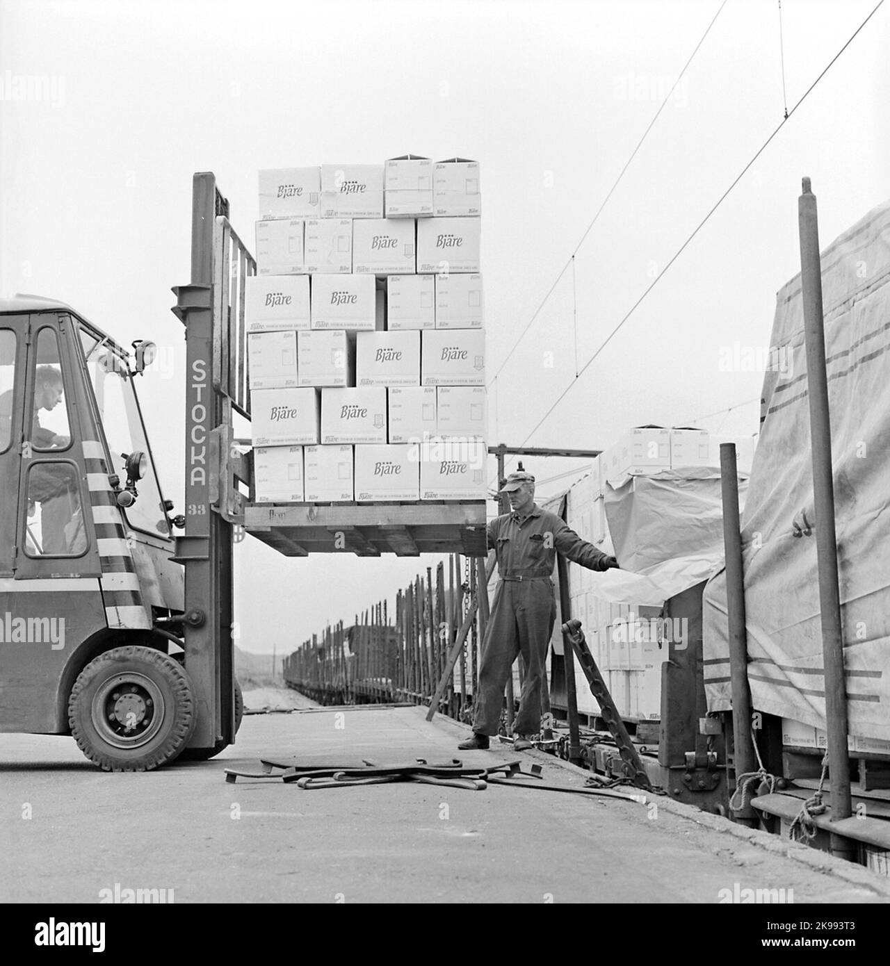 Loading of railway wagon Stock Photo - Alamy
