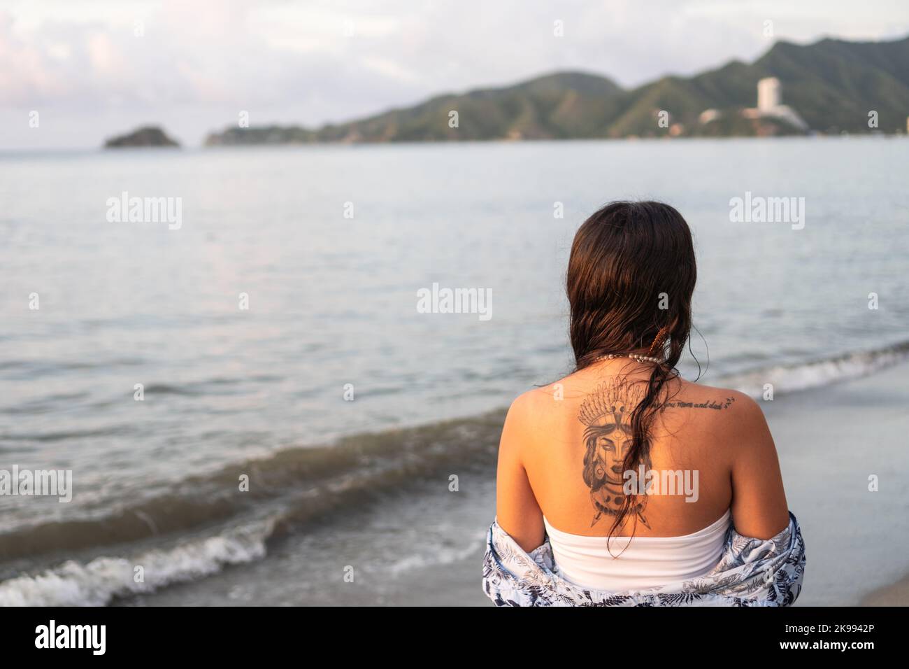 Woman on beach, rear view, close-up Stock Photo - Alamy