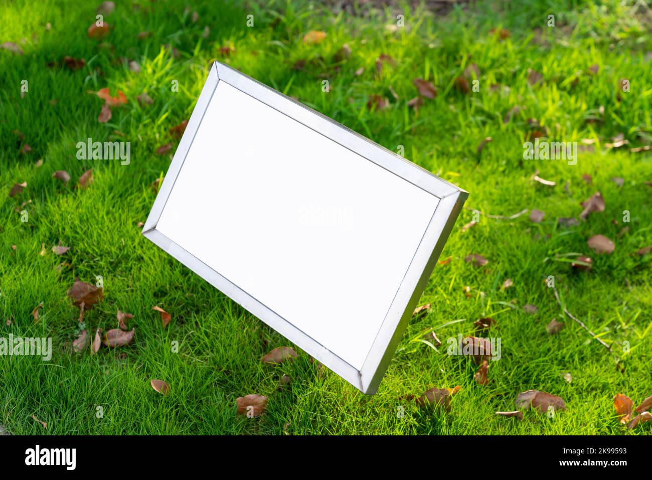 Ad billboard standing in a field of grass Stock Photo - Alamy