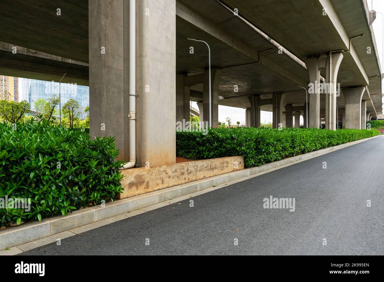 Concrete structure and asphalt road space under the overpass in the ...
