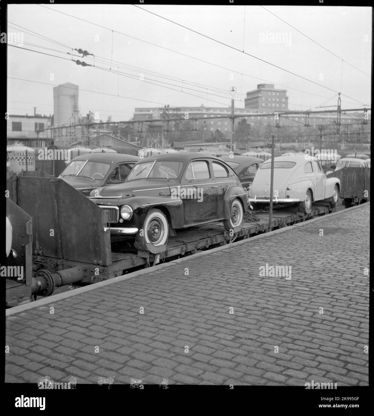 The State Railways, SJ O 77063. O-car loaded with Volvo cars, double ...