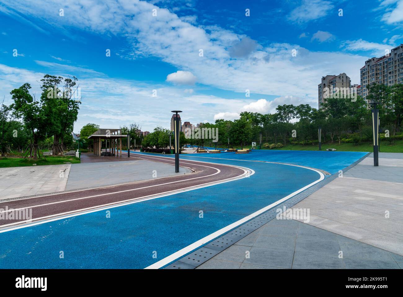 Summer landscape with green grass, road and clouds Stock Photo - Alamy