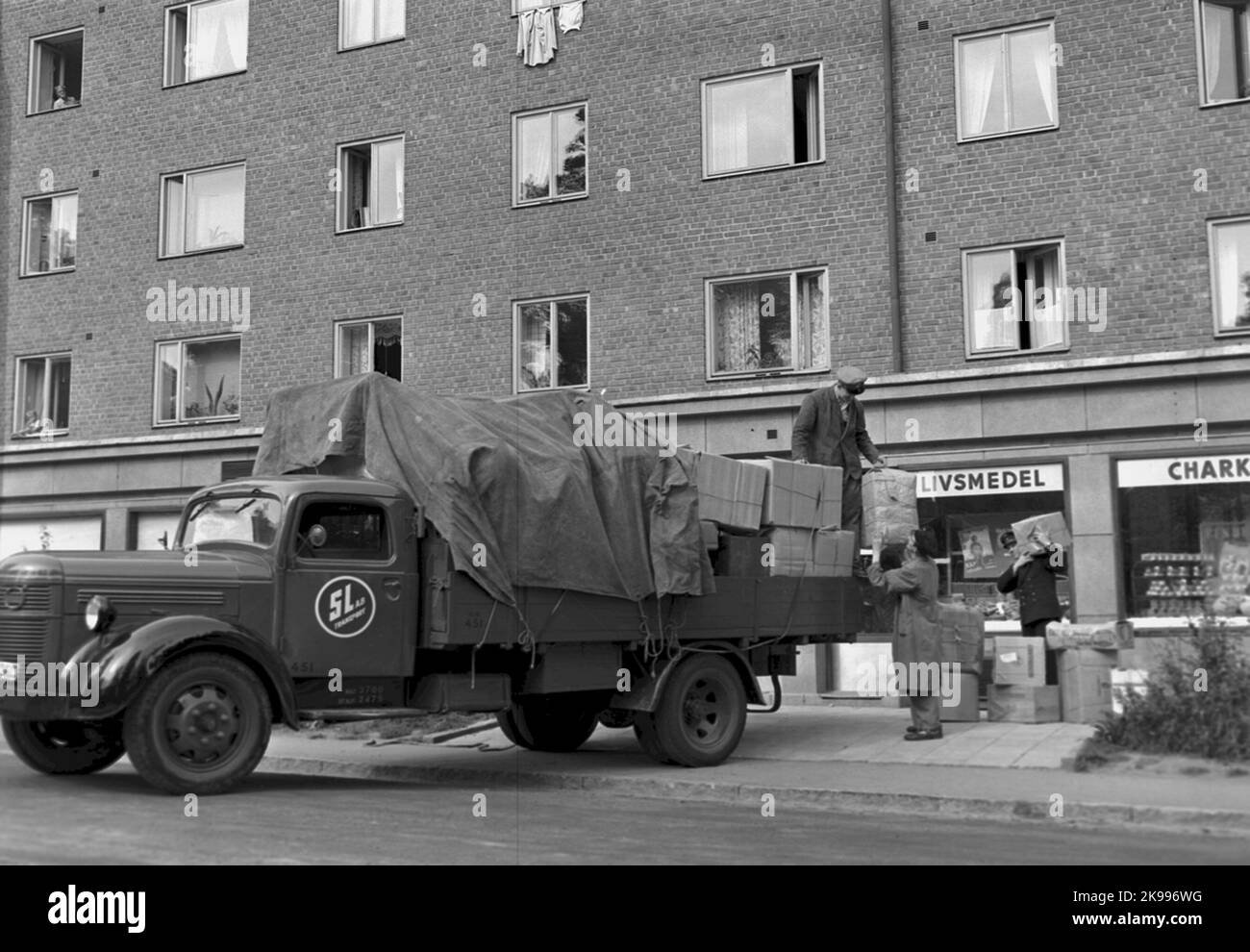 Volvo LV 192. Truck with text SL AB Transport. Grocery store in the ...