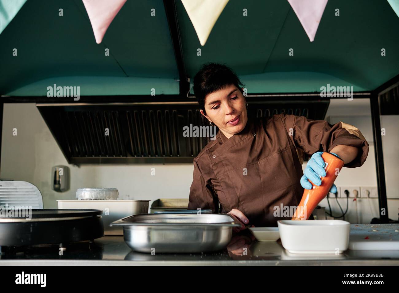 Female restaurant kitchen employee hi-res stock photography and images ...